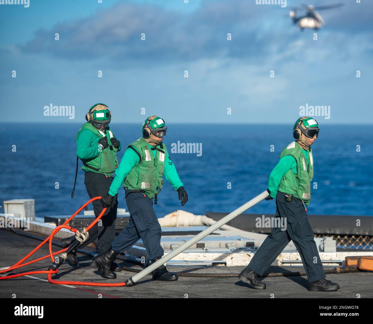 221128-N-UF592-1074 PHILIPPINE SEA (Nov. 28, 2022) Sailors carry a ...