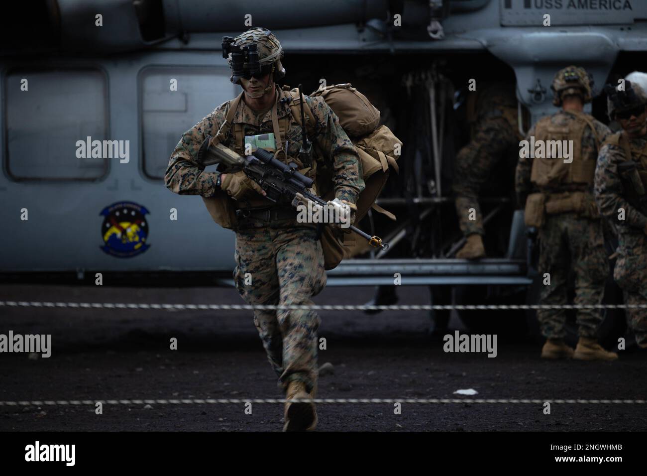 U.S. Marines with 1st Battalion, 2d Marines disembark a U.S. Navy MH ...