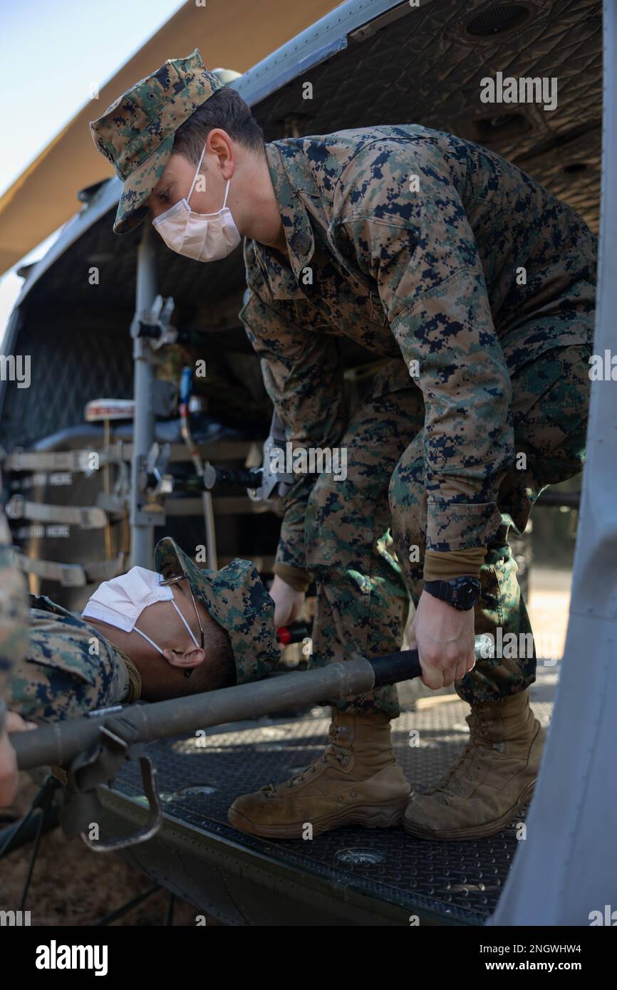 U.S. Navy Petty Officer 3rd Class Joshua Roland, a corpsman with 3rd ...