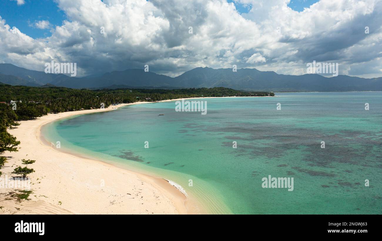 Tropical beach with palm trees. Tropical beach scenery. Pagudpud ...