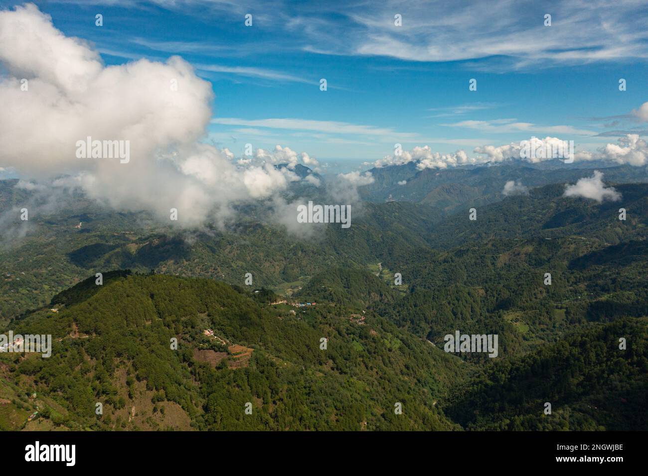 Aerial drone of mountain slopes covered with rainforest and jungle View ...