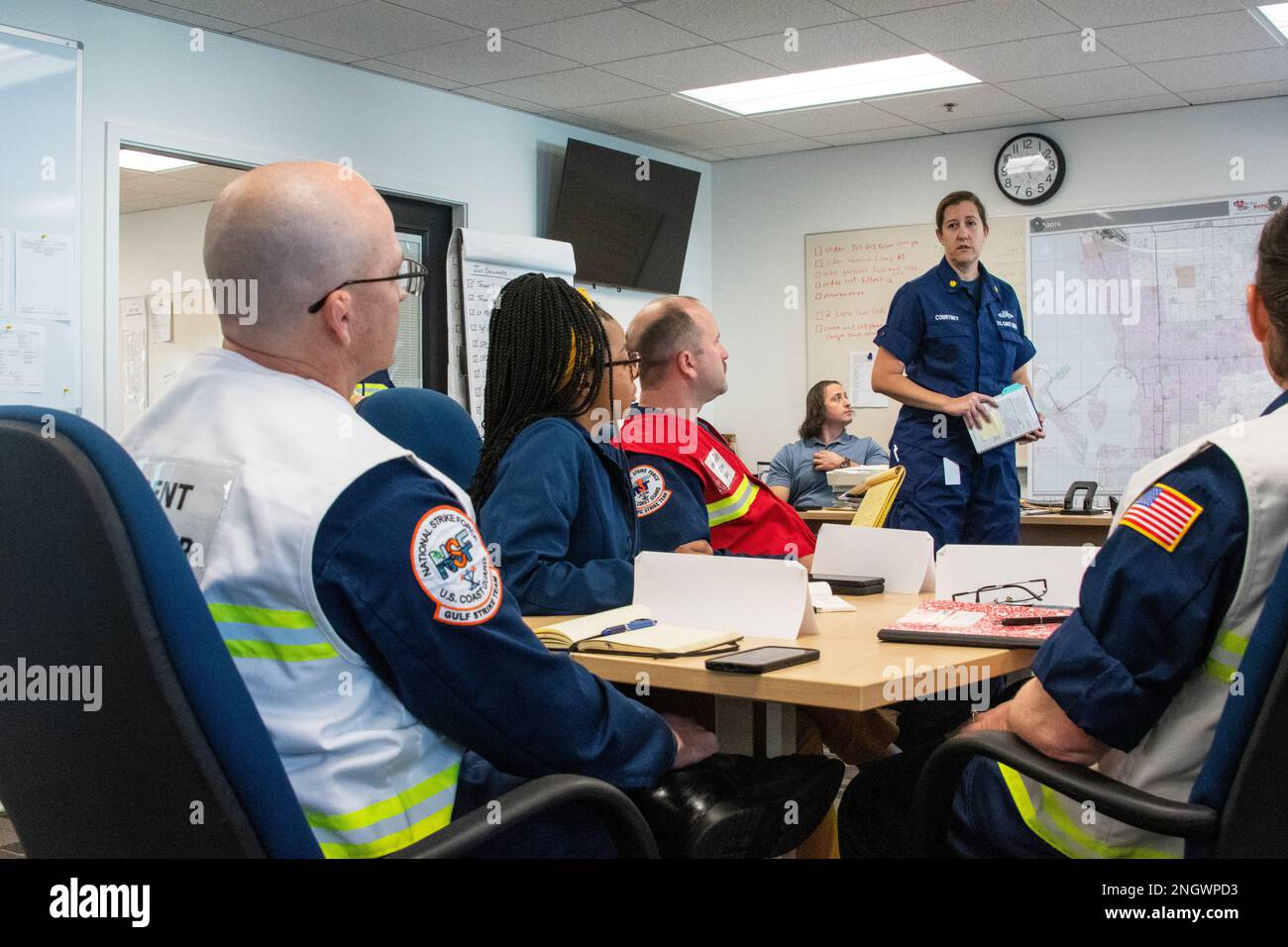 Coast Guard Lt. Cmdr. Lucy Courtney holds a briefing at the Hurricane ...