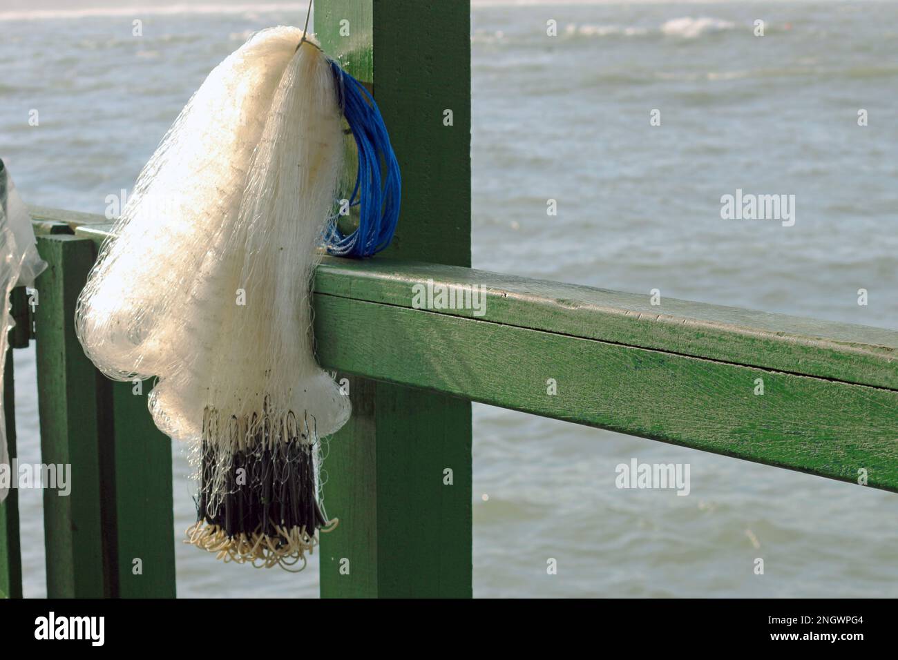 instrument of fishermen, a net hanging from the pier post Stock Photo ...