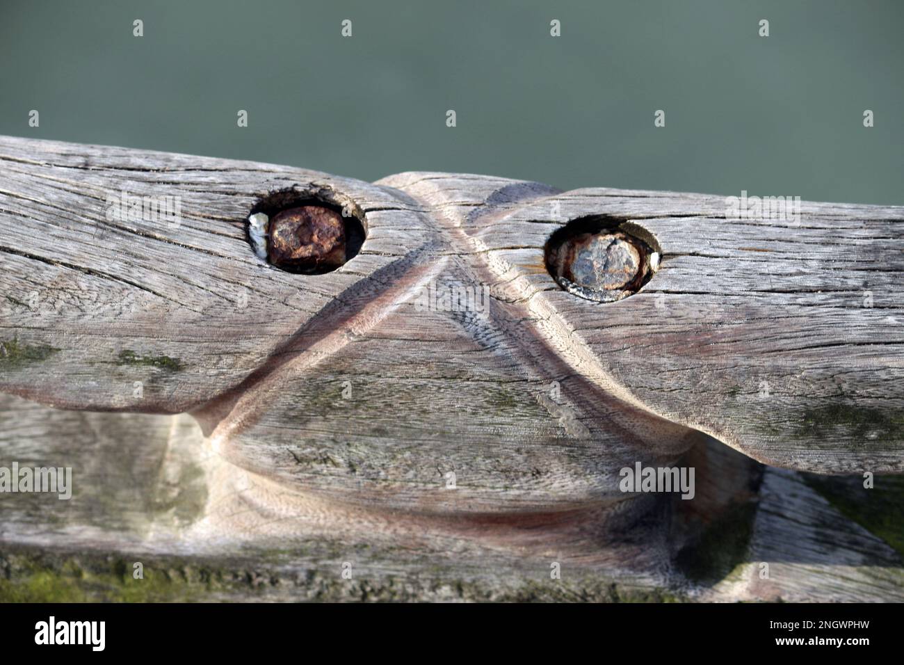 At the dock, time leaves marks on the wood. Ropes, nails and screws ...