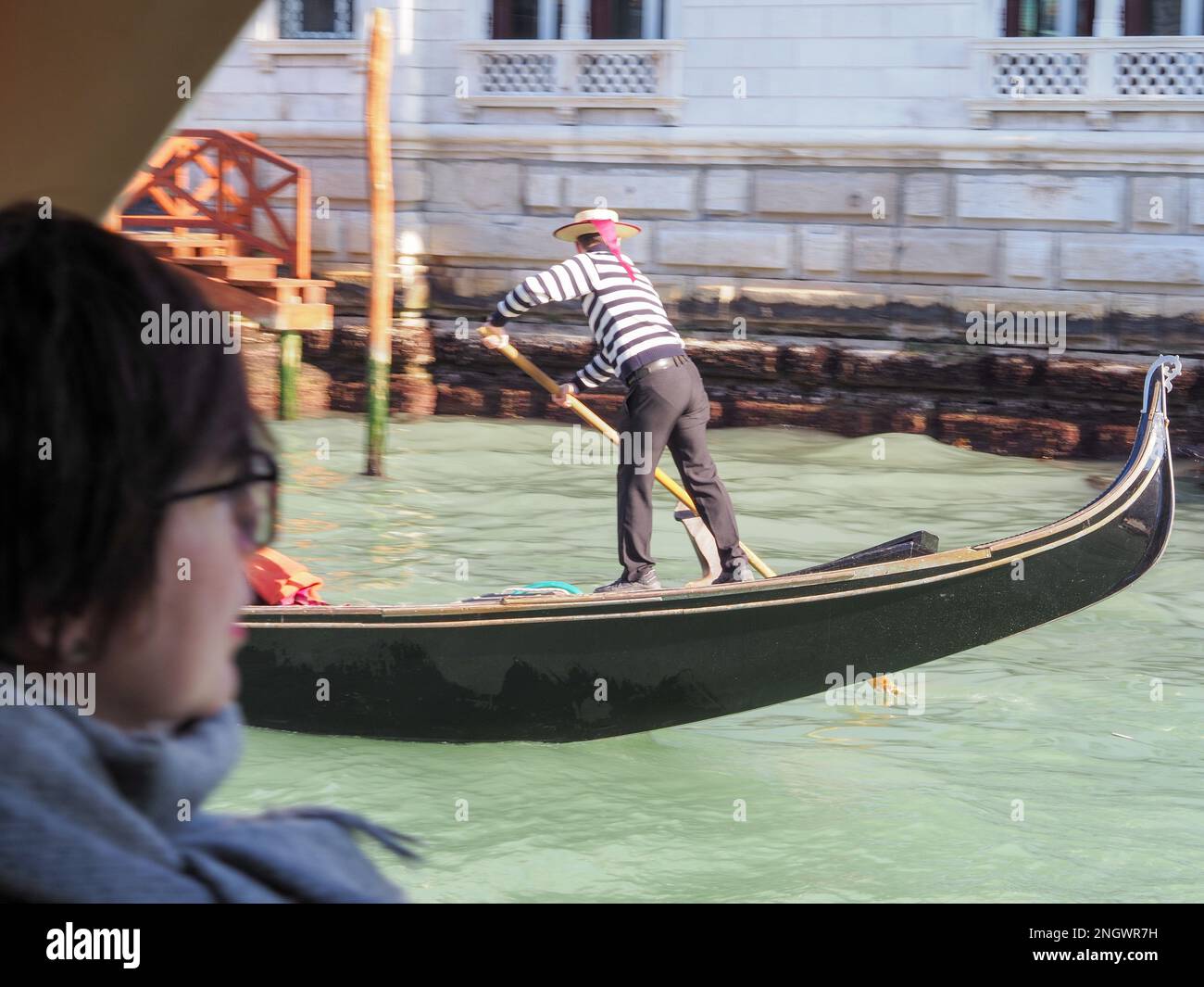 Venice, Italy - 13th february 2023 Venetian Gondolier riding rowing ...