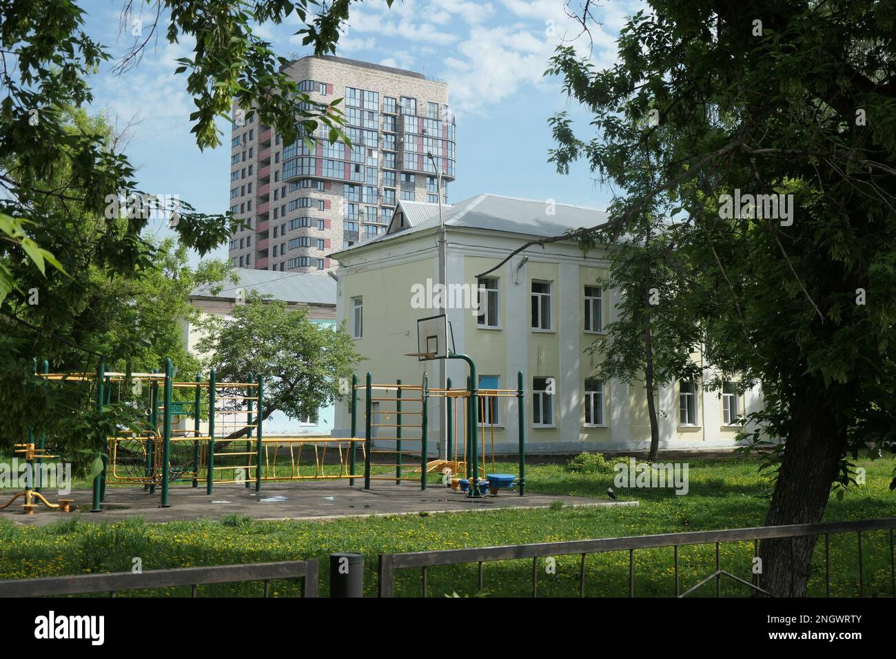 Cityscape with school and it's playground Stock Photo - Alamy