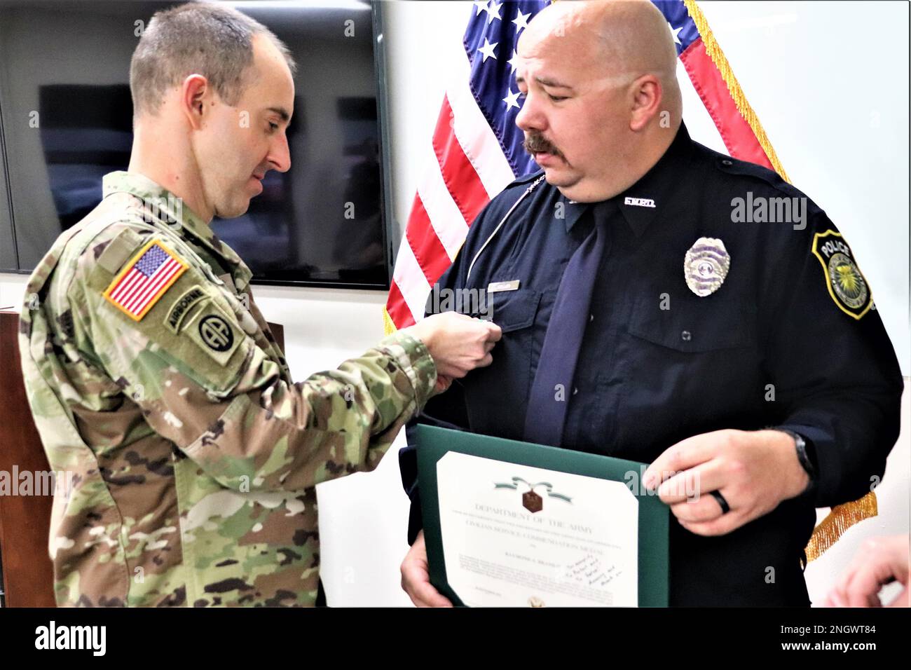 Police Officer Raymond A. Brand II receives the Department of the Army ...