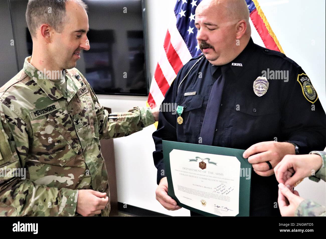 Police Officer Raymond A. Brand II receives the Department of the Army ...