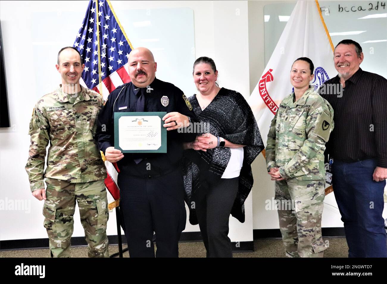 Police Officer Raymond A. Brand II receives the Department of the Army ...