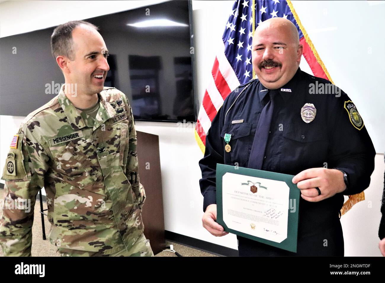 Police Officer Raymond A. Brand II receives the Department of the Army ...