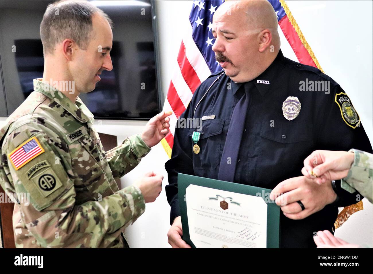 Police Officer Raymond A. Brand II receives the Department of the Army ...