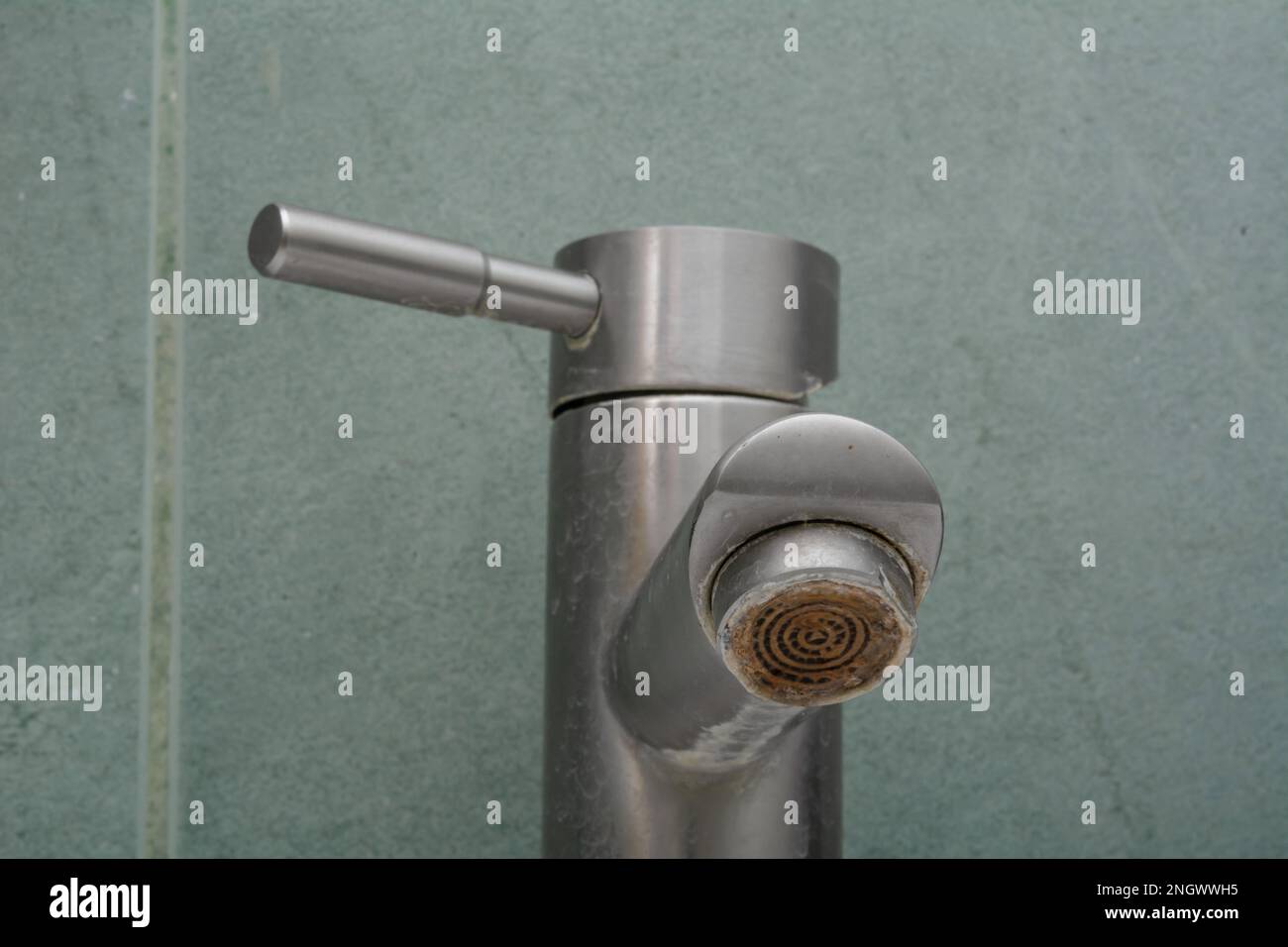 Faucet limescale. Dirty faucet aerator with limescale, calcified shower ...