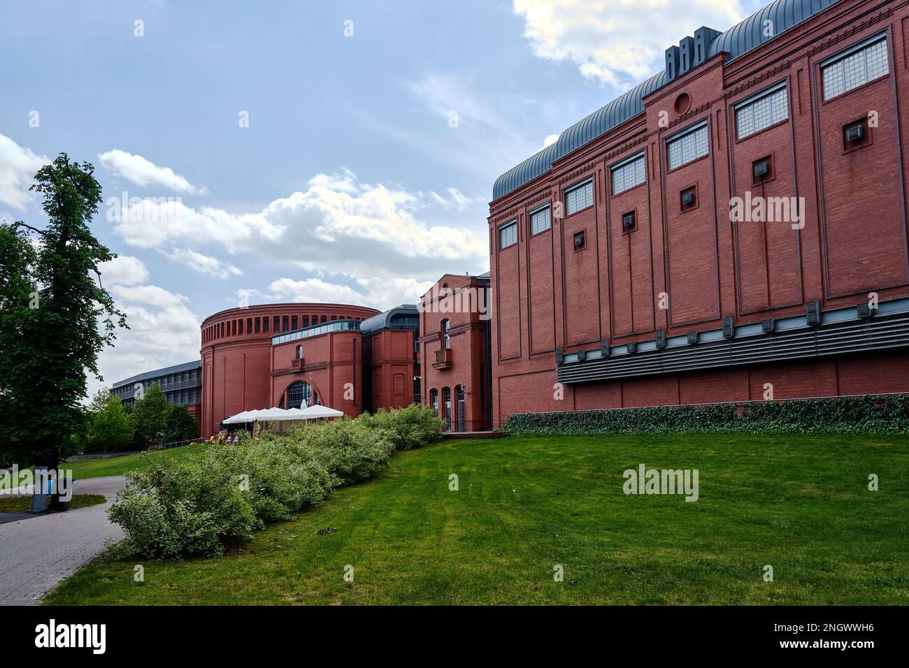 Park and historic renovated buildings of the old red brick brewery in ...