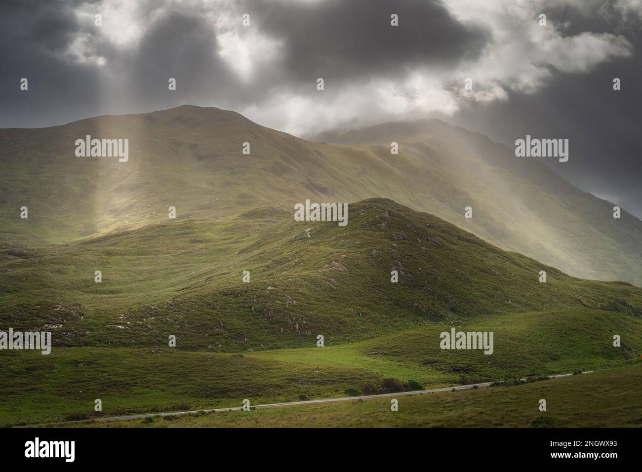 Doolough Valley, Glenummera and Glencullin mountain ranges illuminated ...