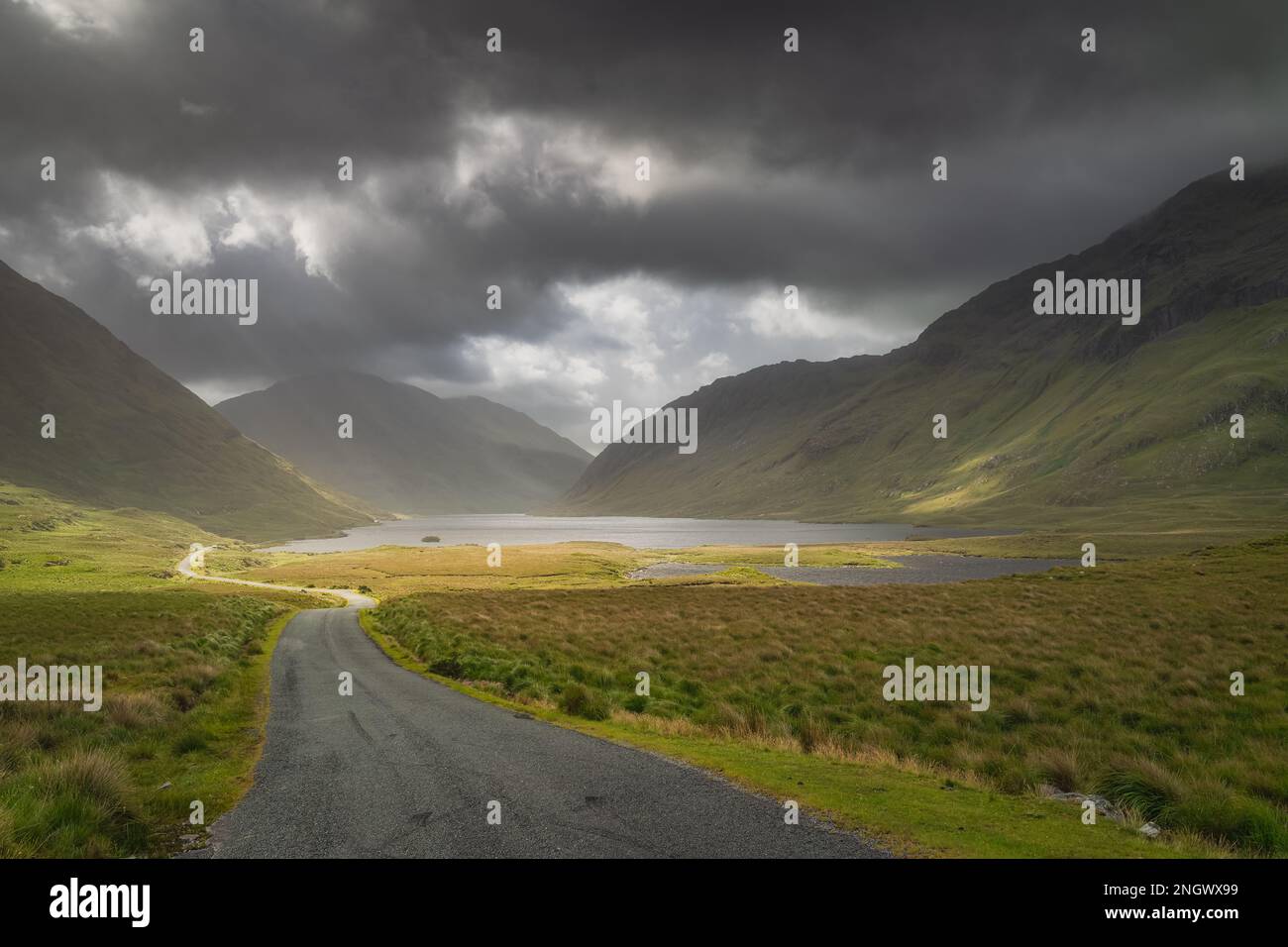 Road leading trough Doolough Valley with lakes, between Glenummera and ...