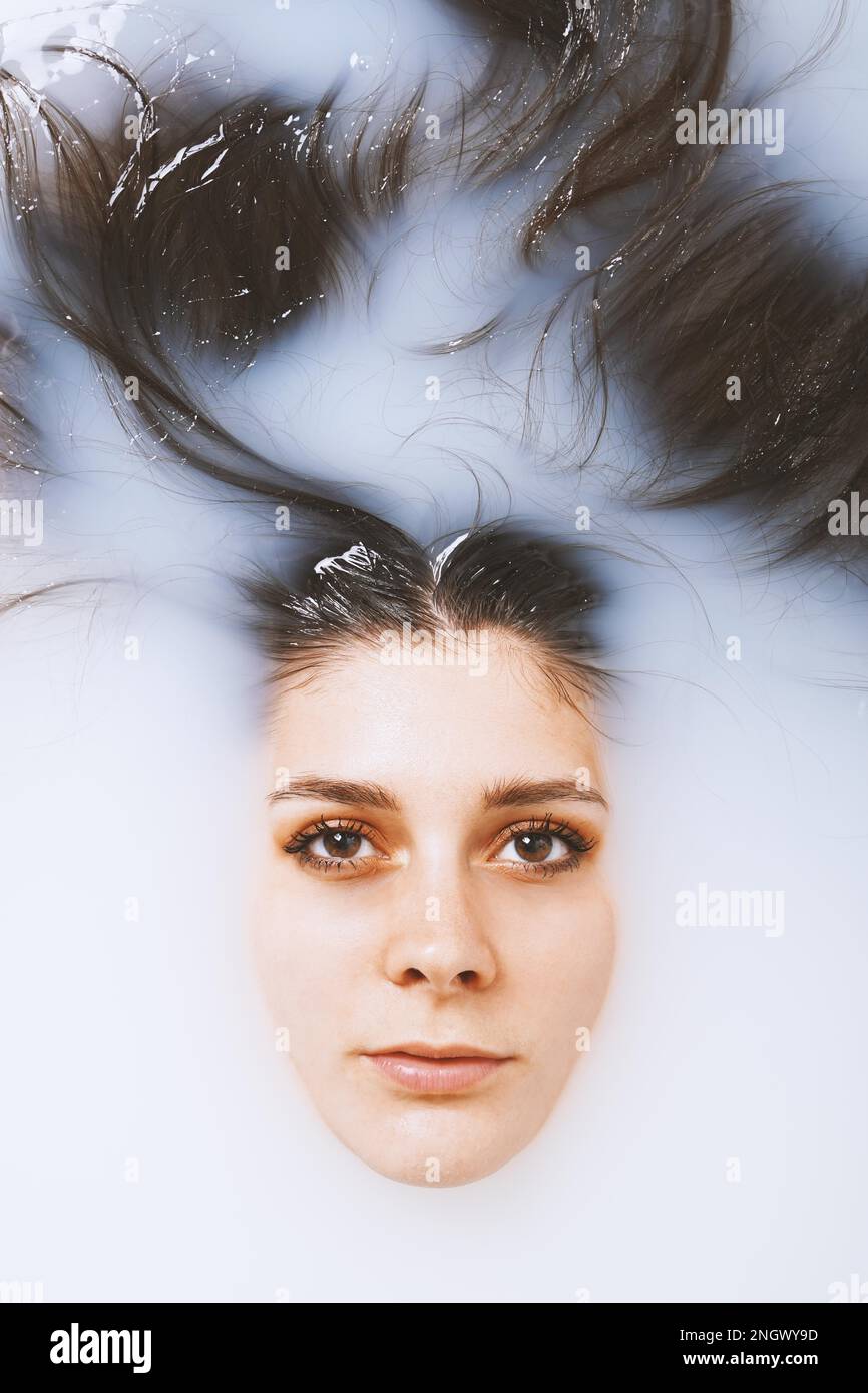 Beauty Portrait Of Young Woman Face And Brunette Long Hair Floating In
