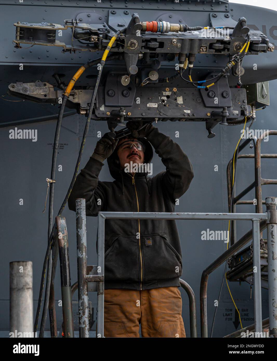 A Crew chief with the 5th Bomb Wing prepares a b-52H Stratofortress ...