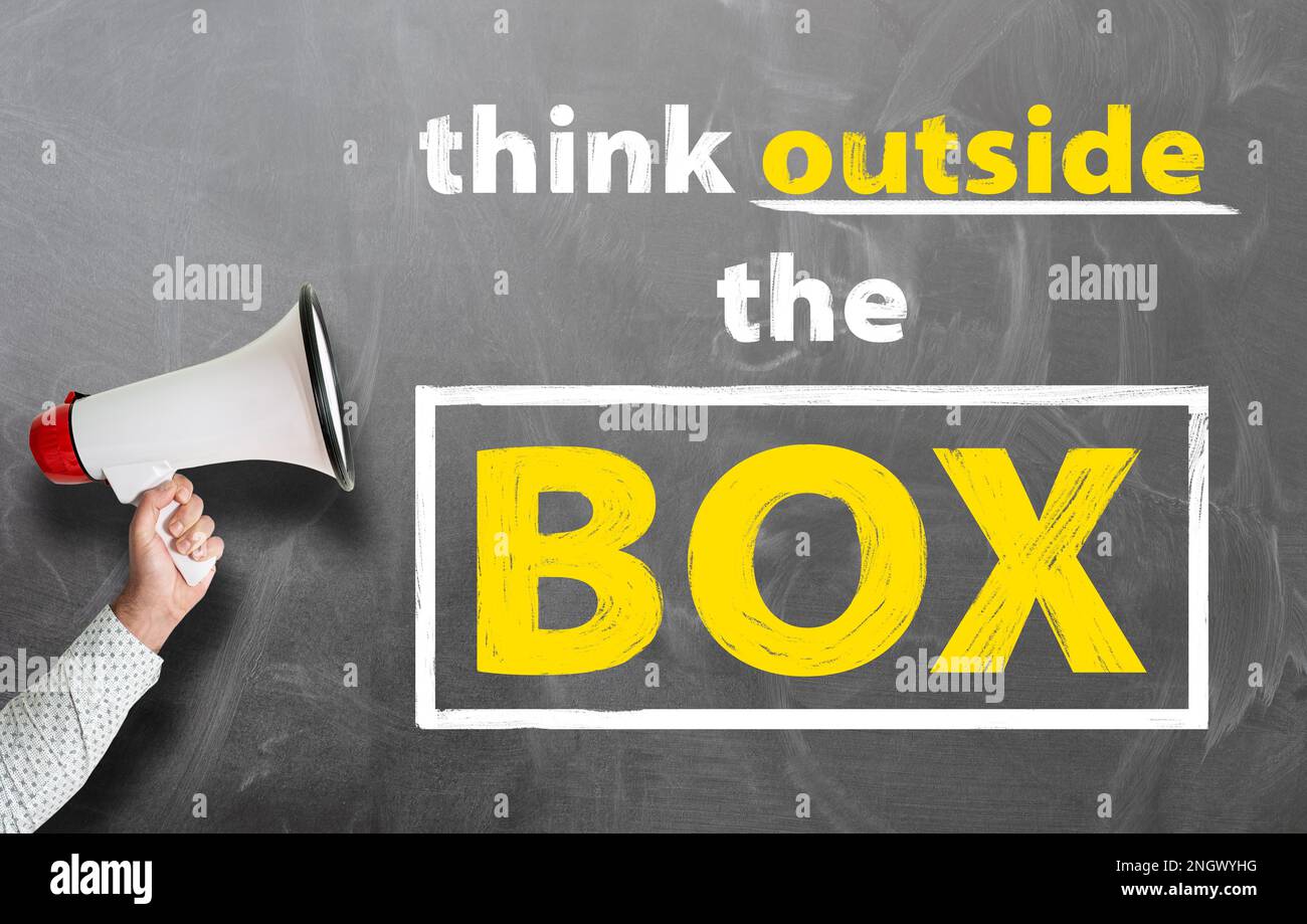 hand holding red and white megaphone against chalkboard with text THINK ...