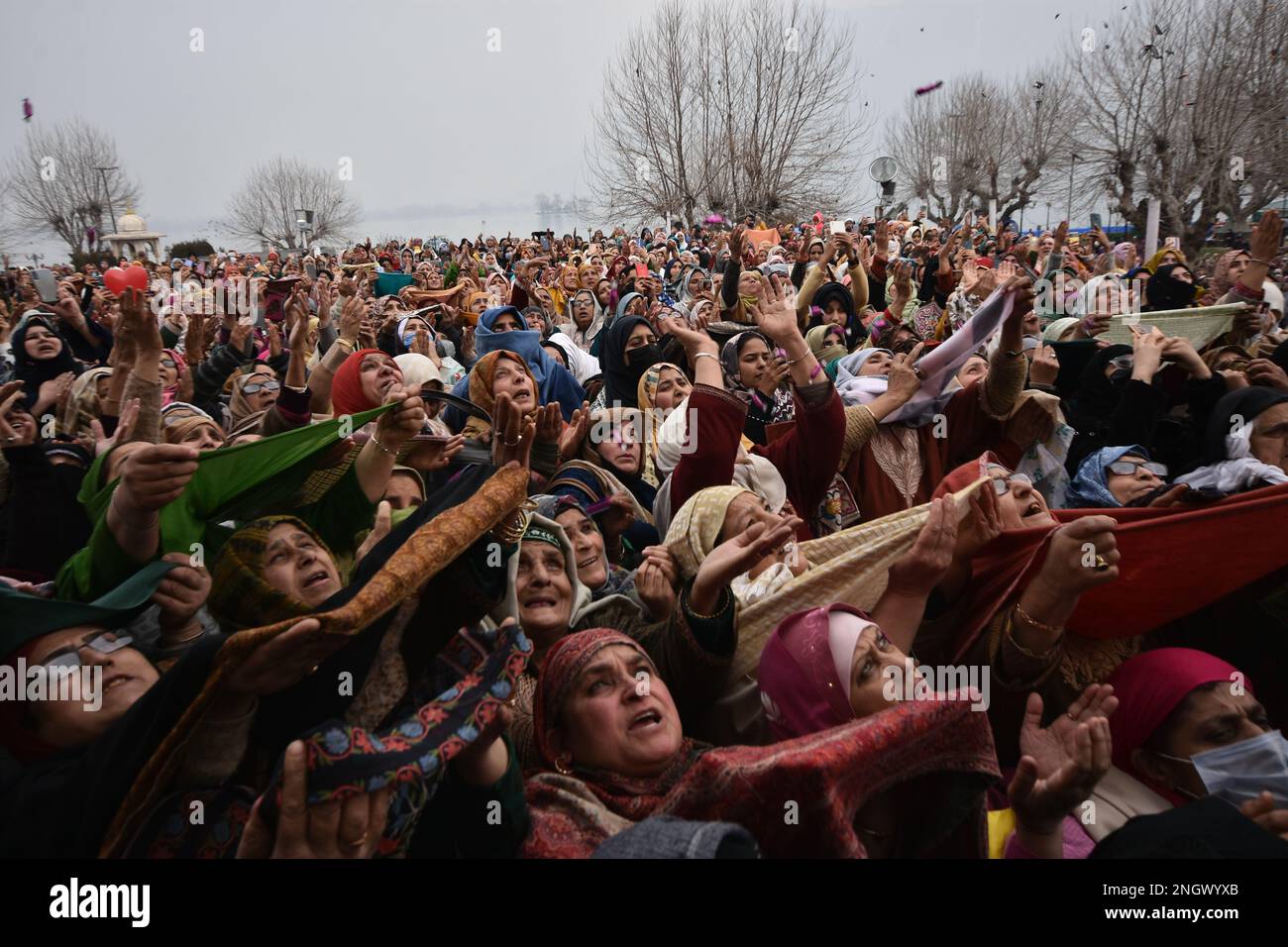 Muslim women raise their hands in prayers as the head cleric (unseen ...