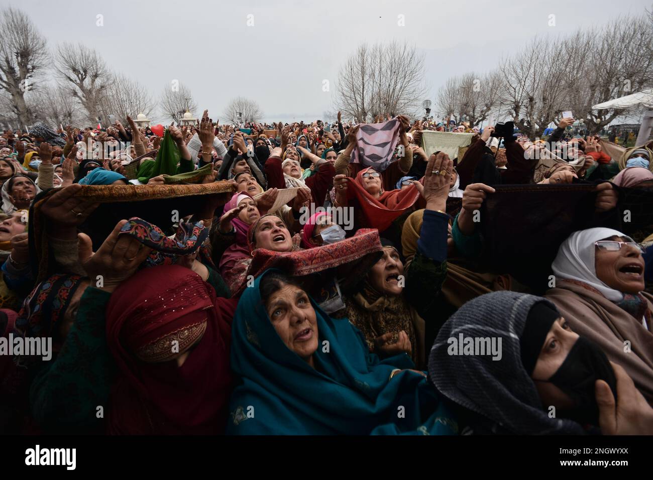 Muslim women raise their hands in prayers as the head cleric (unseen ...