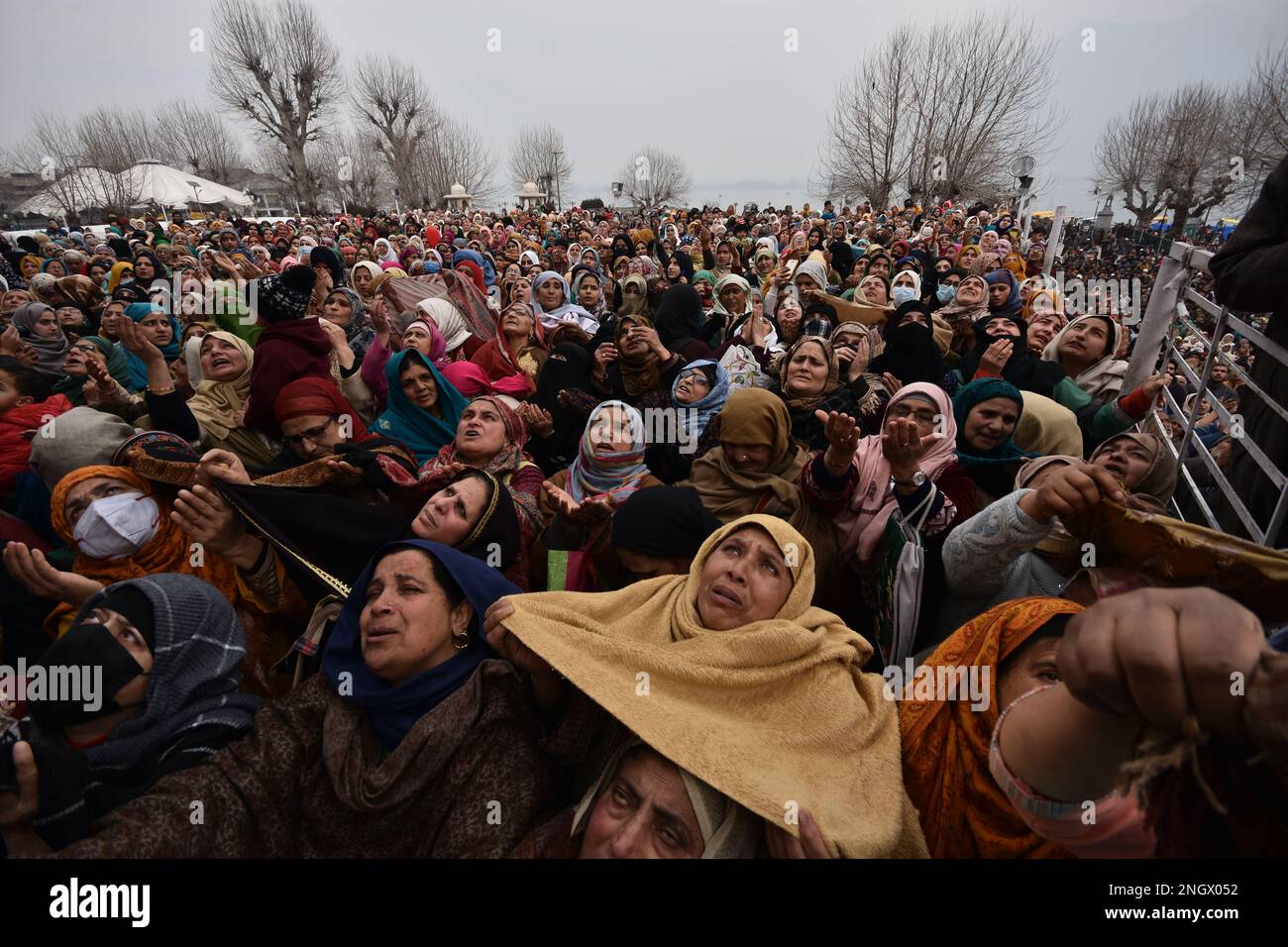 Muslim women raise their hands in prayers as the head cleric (unseen ...