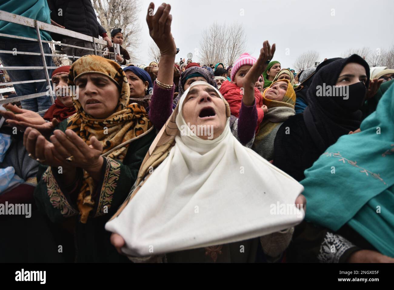 Muslim women raise their hands in prayers as the head cleric (unseen ...