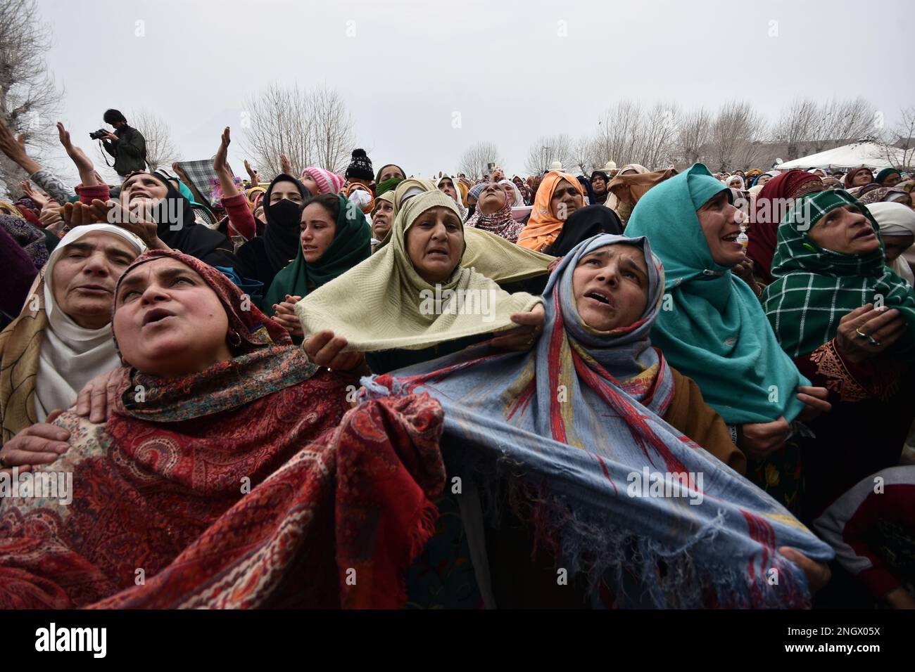 Muslim women raise their hands in prayers as the head cleric (unseen ...