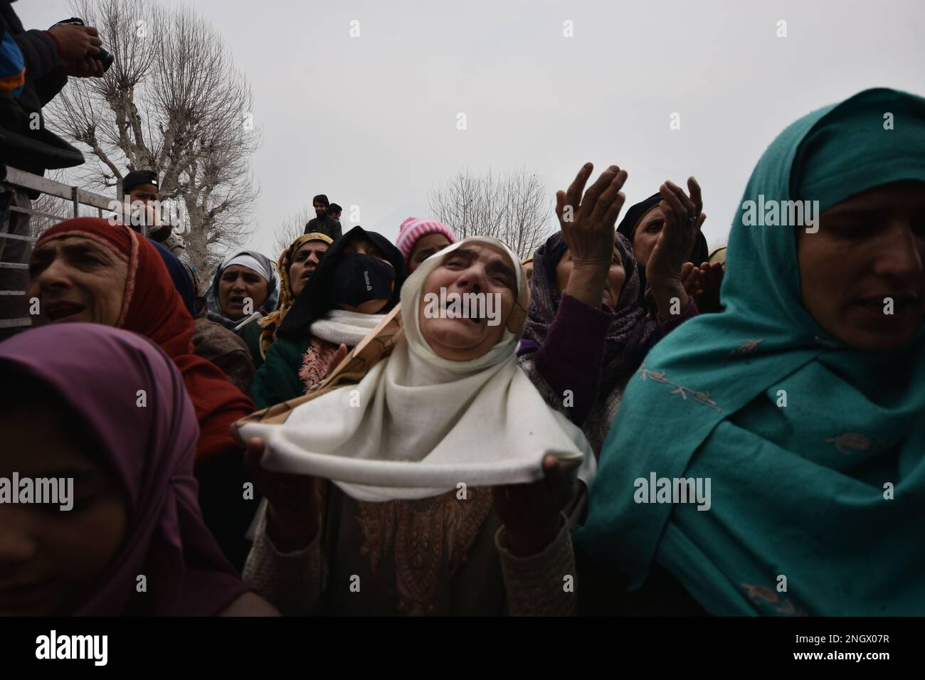 Muslim women raise their hands in prayers as the head cleric (unseen ...