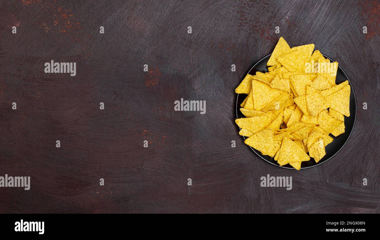 nachos black bowl brown background. High resolution photo Stock Photo ...