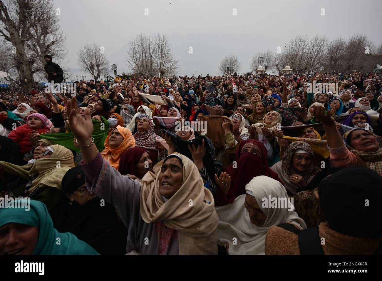 Muslim women raise their hands in prayers as the head cleric (unseen ...