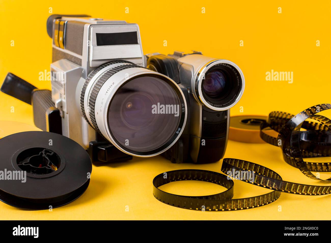 modern camera film reel film strips yellow background Stock Photo - Alamy