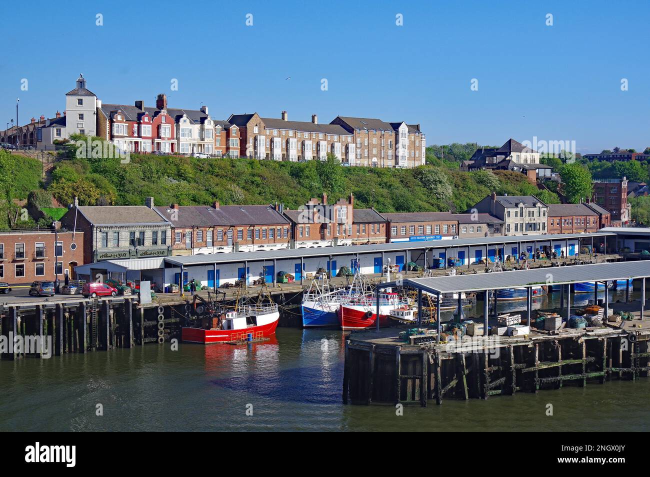 Fish market and small fishing boats, dwellings and camps on the River ...