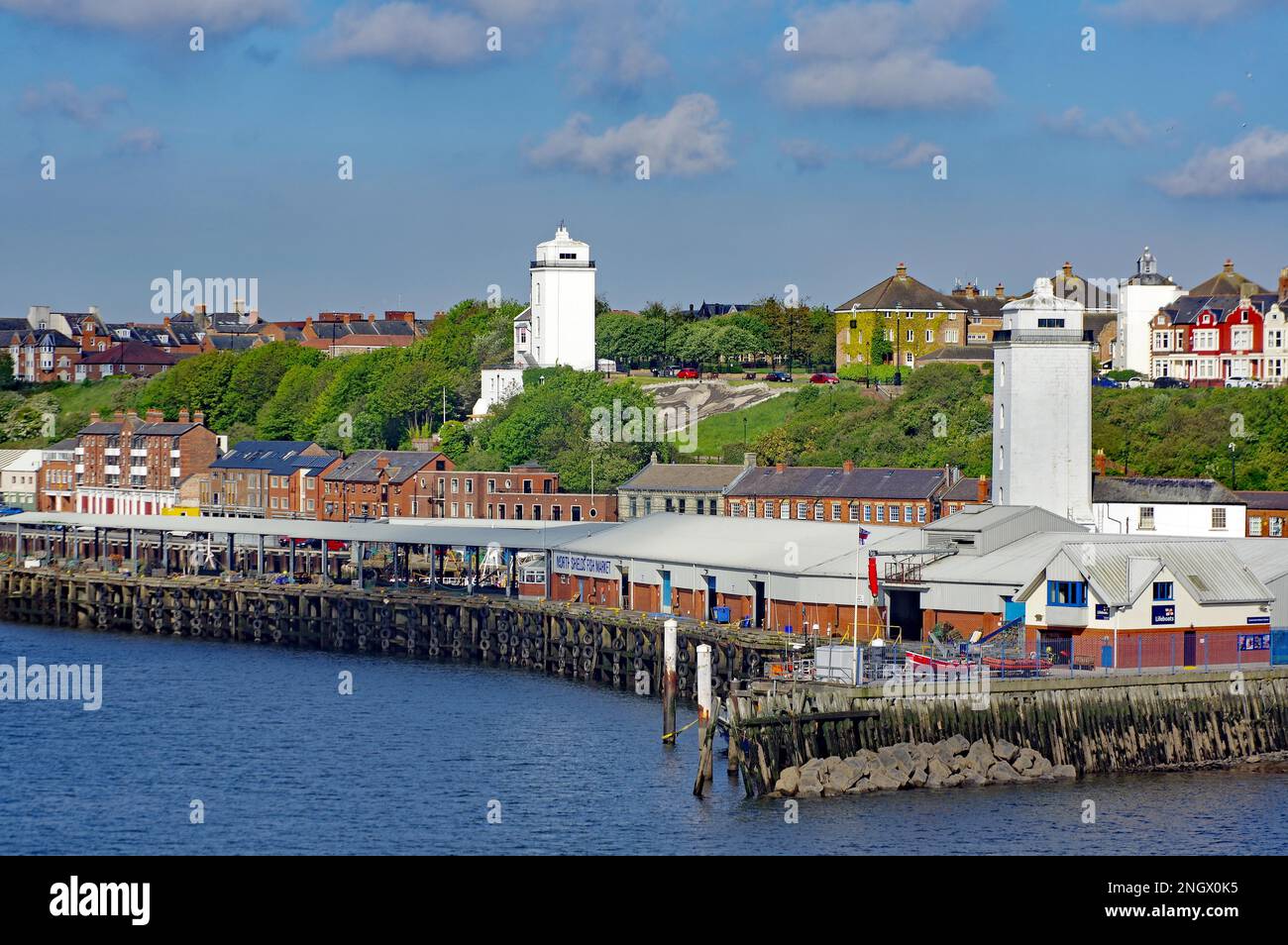 Fish market and small fishing boats, dwellings and camps on the River ...