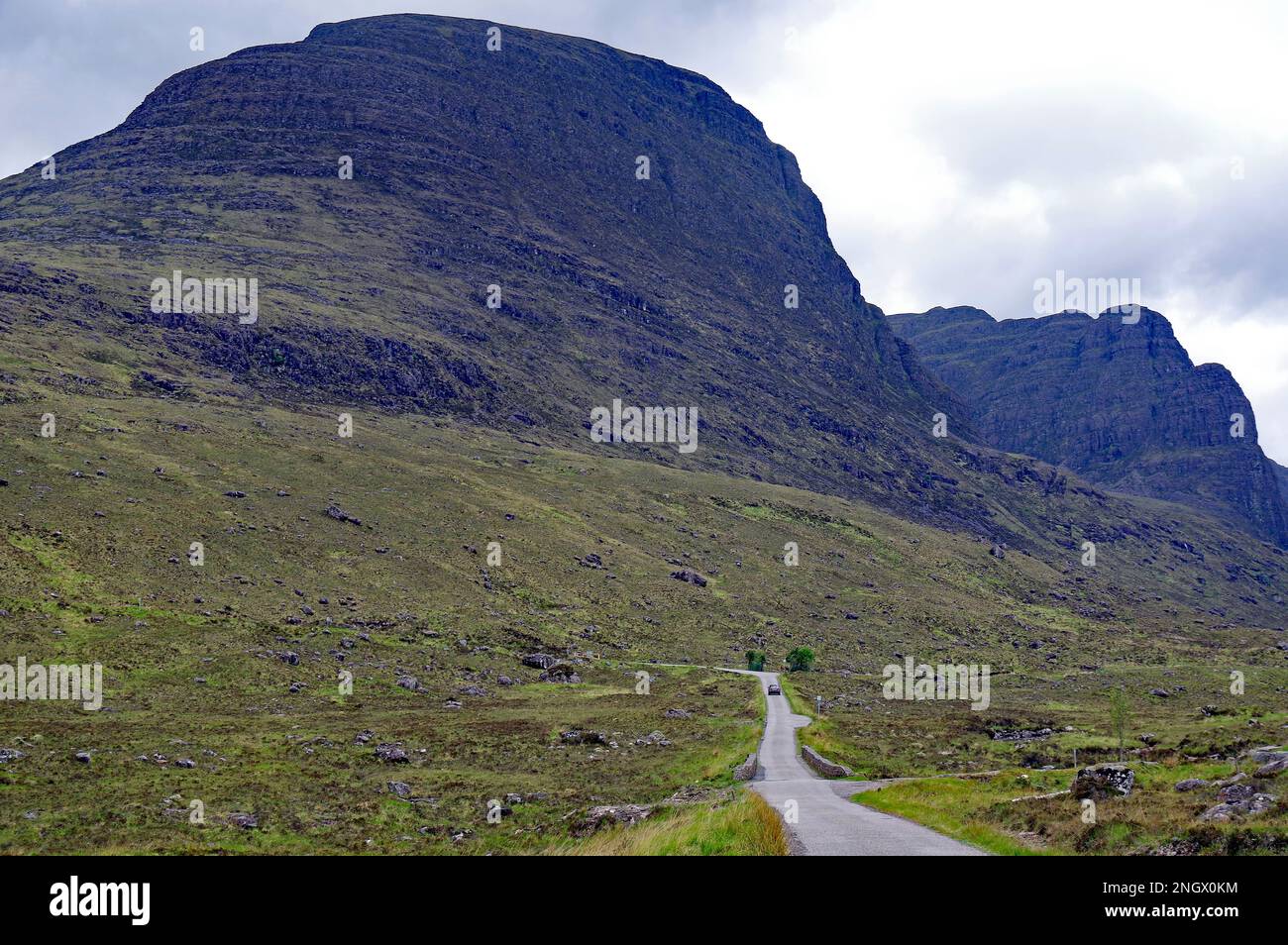Narrow, single track road, winds through wide, green countryside, high ...