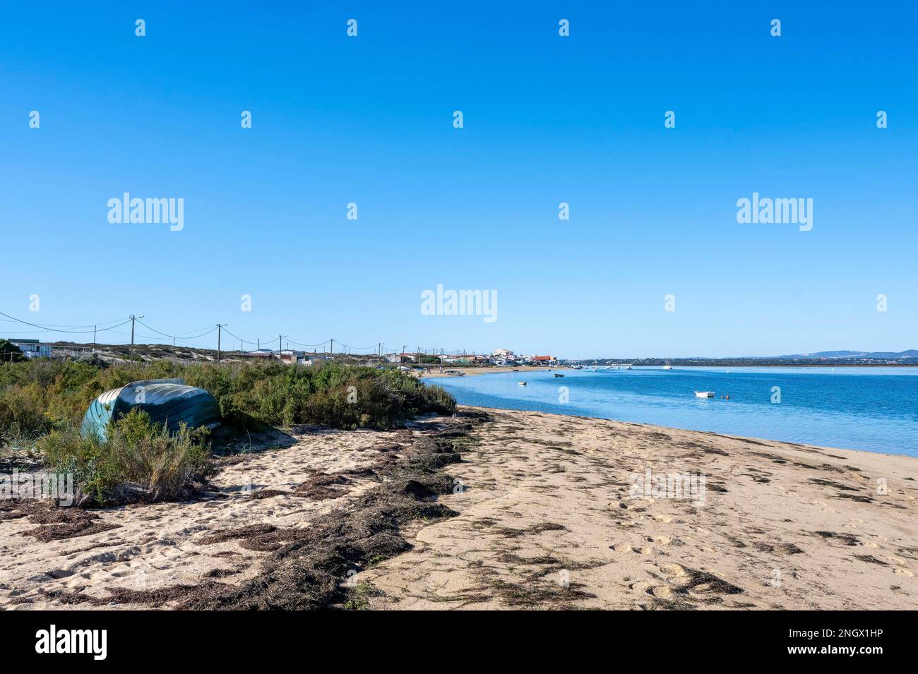 Boat on the beach of the Ria Formosa nature park Park, Faro, Algarve ...
