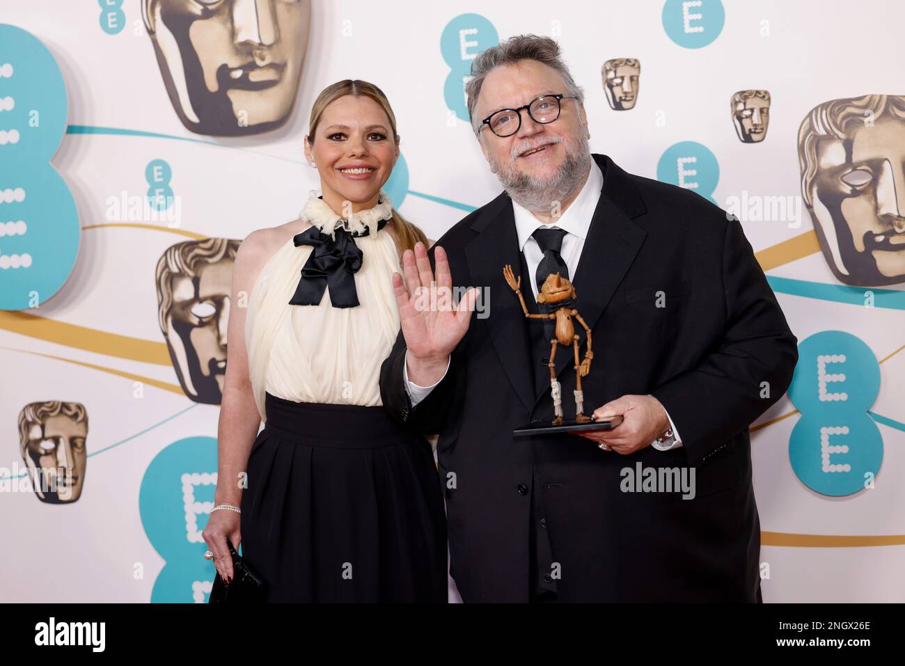 Kim Morgan, left, and Guillermo del Toro pose for photographers upon ...