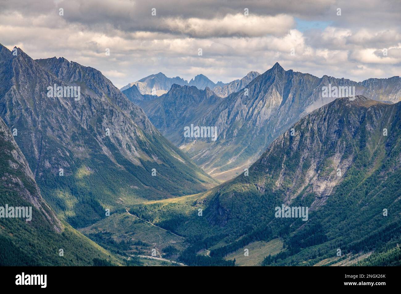 Nestled between towering peaks hi-res stock photography and images - Alamy