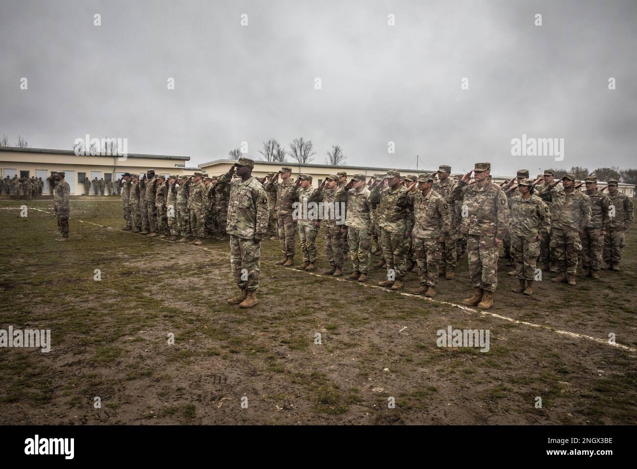 U.S. Army Soldiers render a salute for the National Anthem being played ...