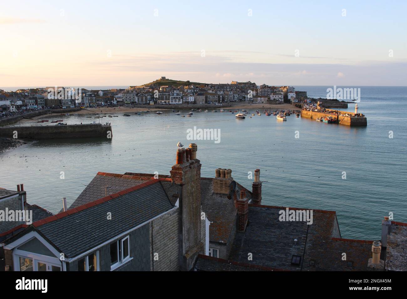 Dusk over St Ives Harbour in summer seen from the hill above Stock ...