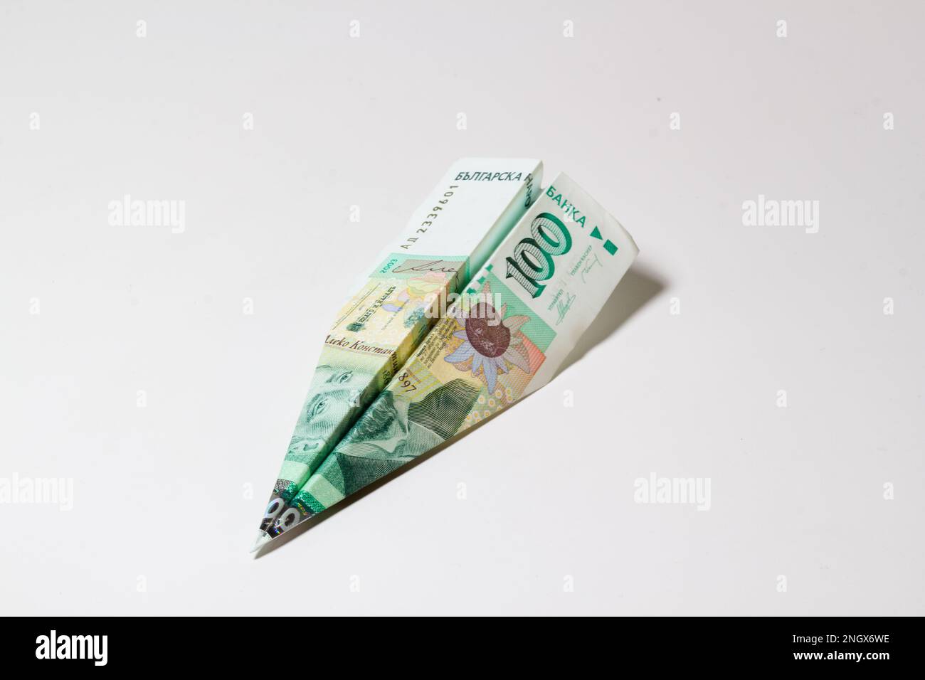 Cash Bulgarian lev banknote folded into airplane isolated on white ...