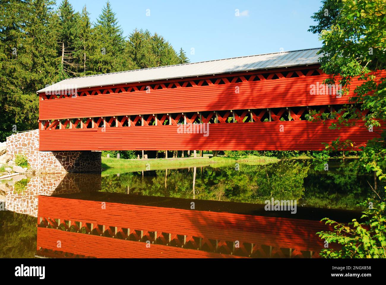 Sachs Covered Bridge is reflected in a calm stream below in Gettysburg ...