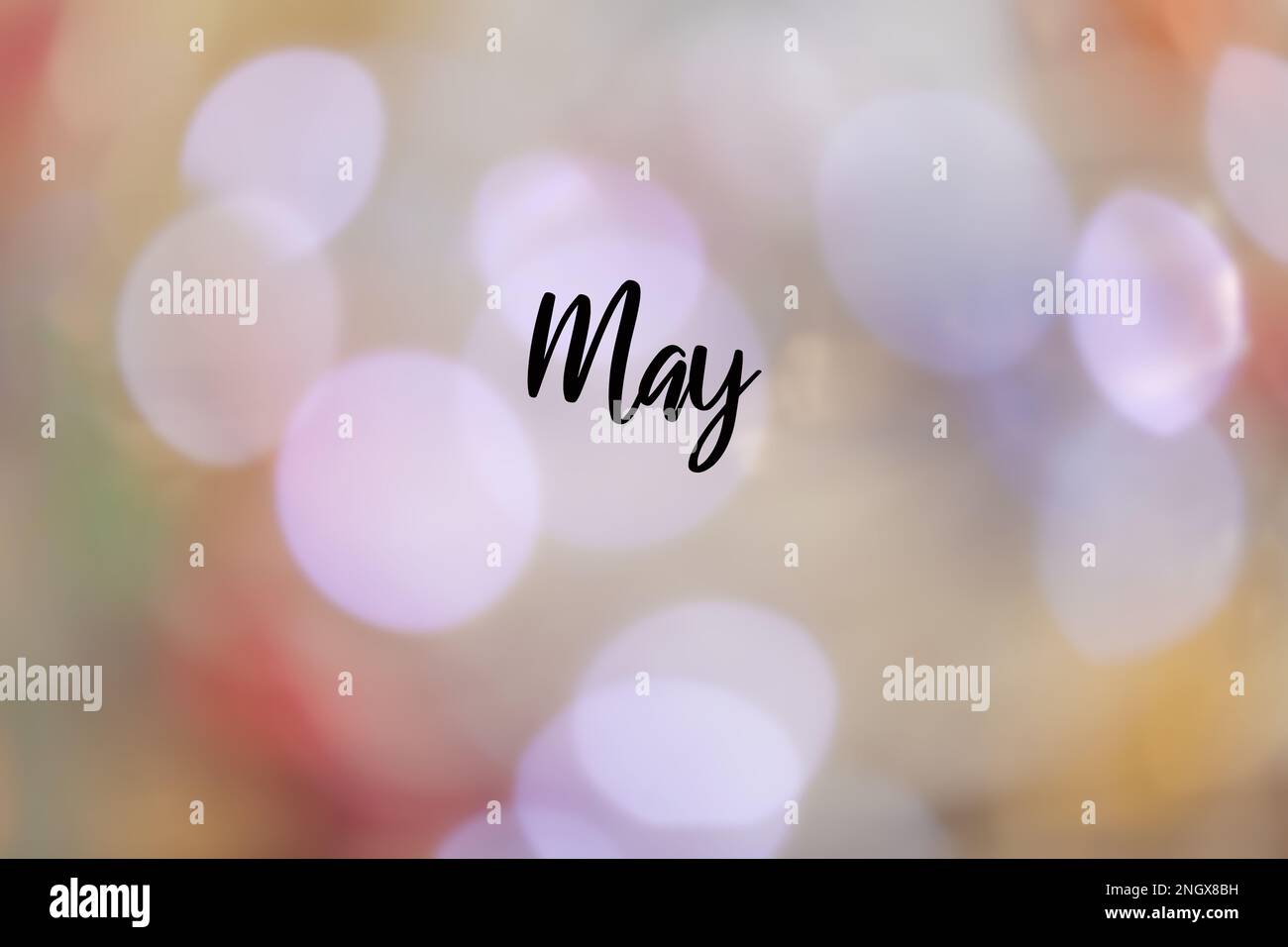 A blurred colorful background with the name "May" in English written on ...
