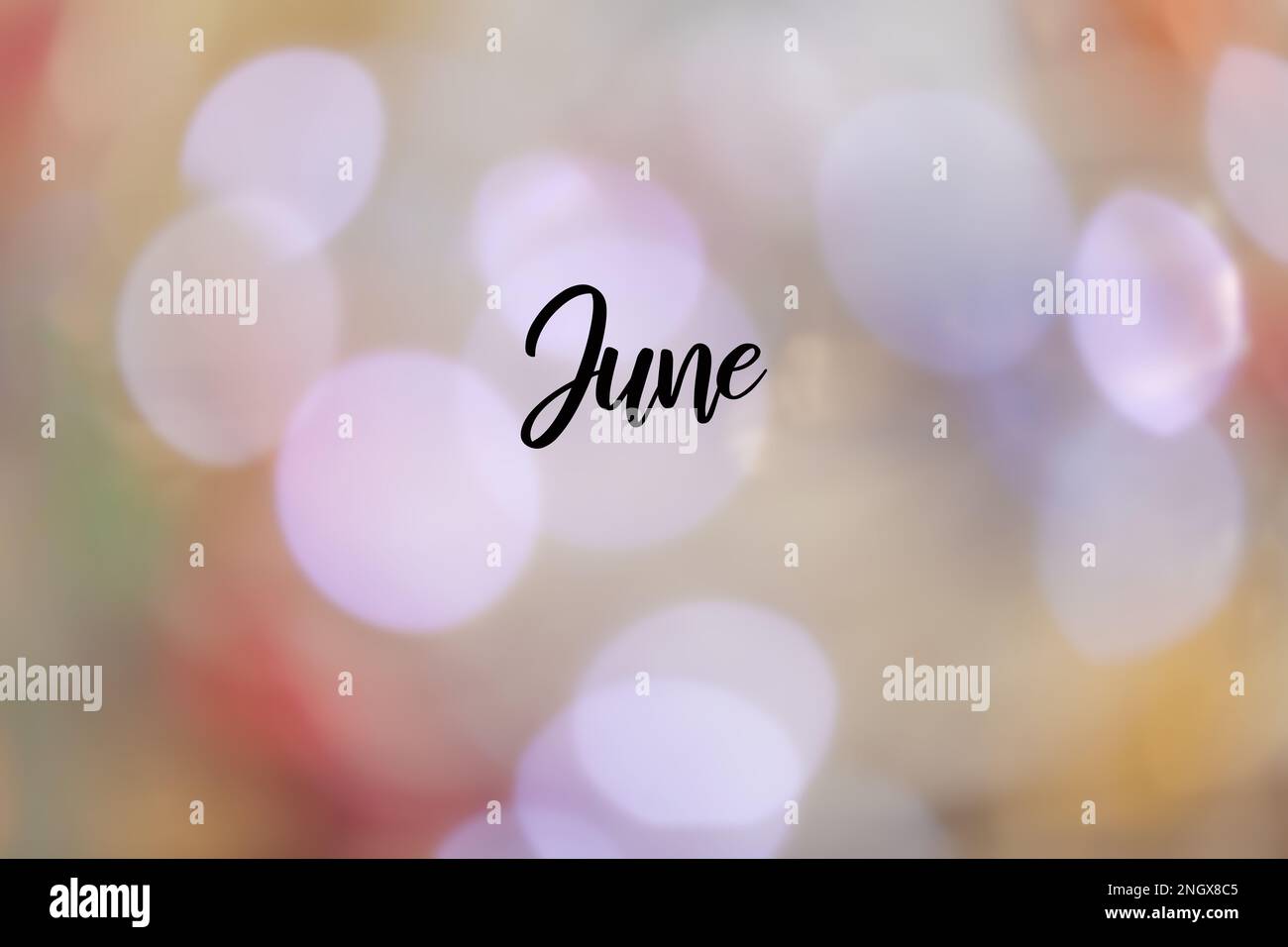 A blurred colorful background with the name "June" in English written ...