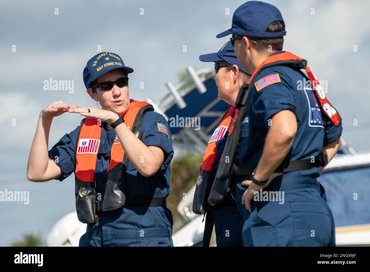 Coast Guard Lt. Cmdr. Lucy Courtney talks with Cmdr. Johna Rossetti and ...