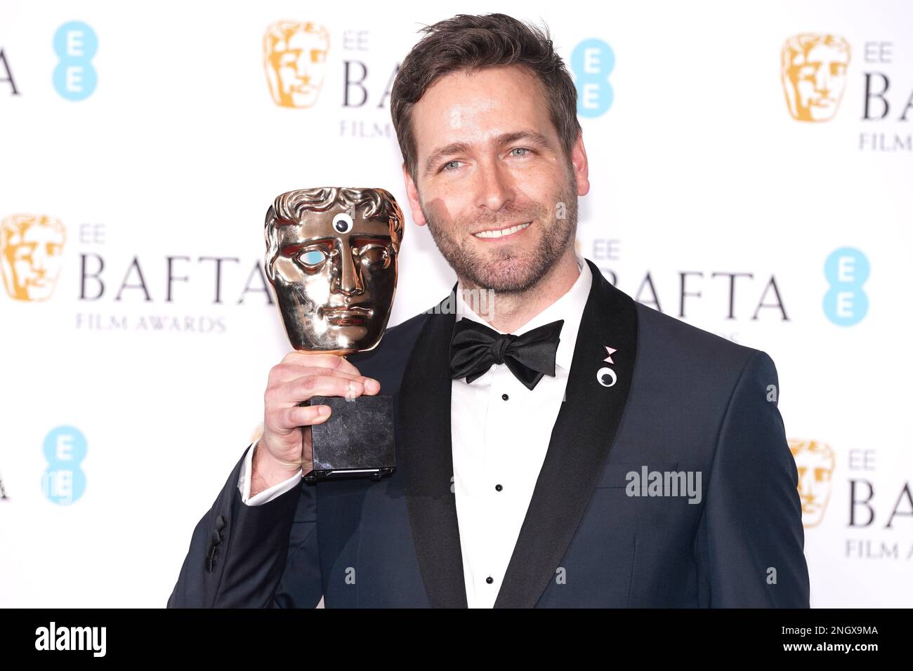 Paul Rogers poses with the award for Editing for film Everything ...