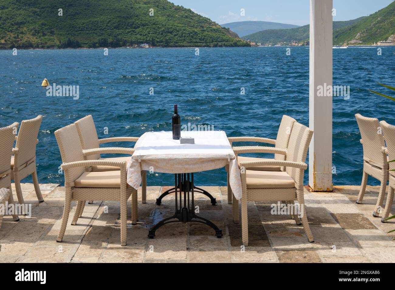 Typical seaside restaurant overlooking the beautiful Bay of Kotor in ...