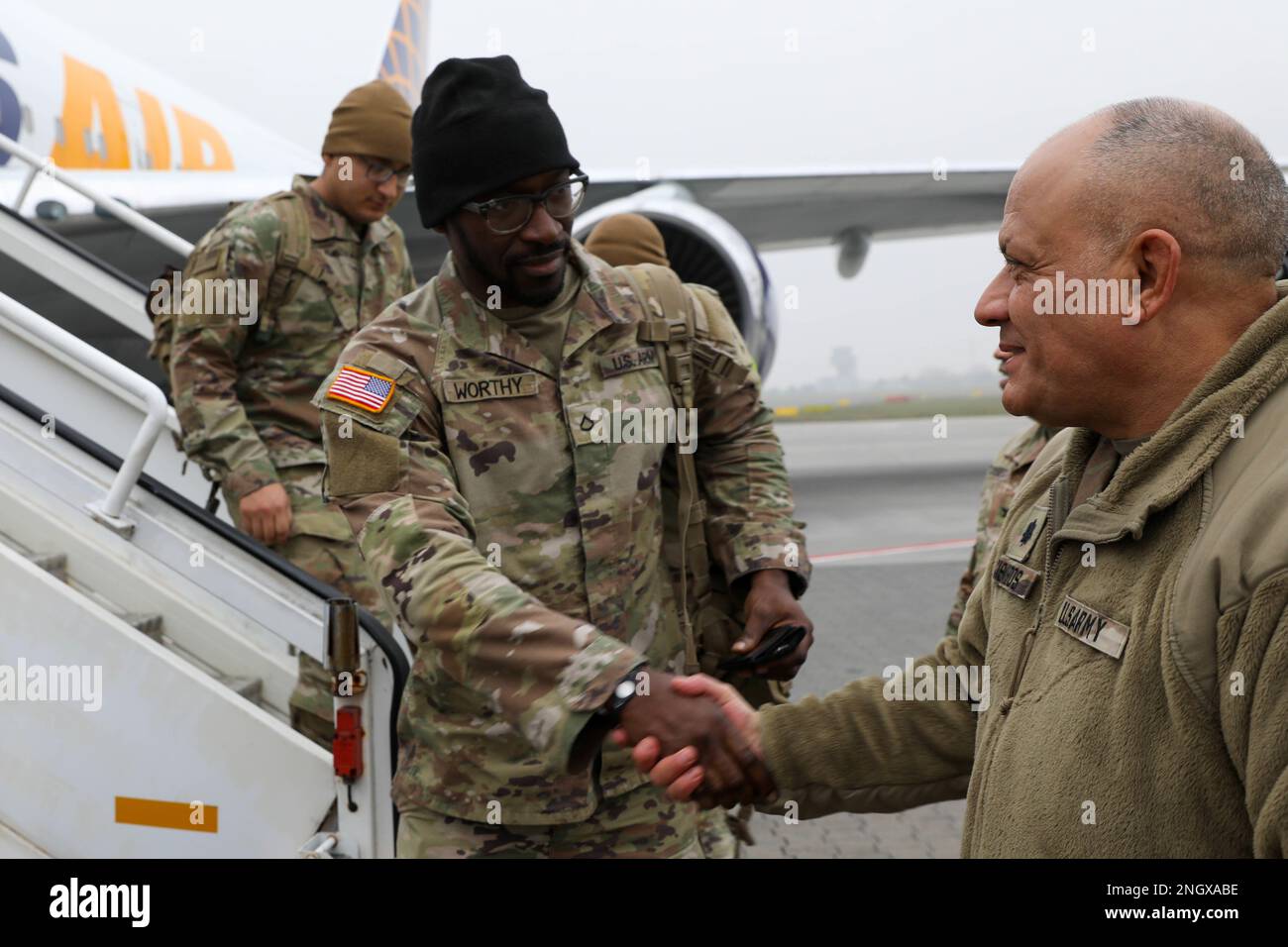U.S. Army Lt. Col. Miguel Cisneros, right, welcomes U.S. Soldiers ...