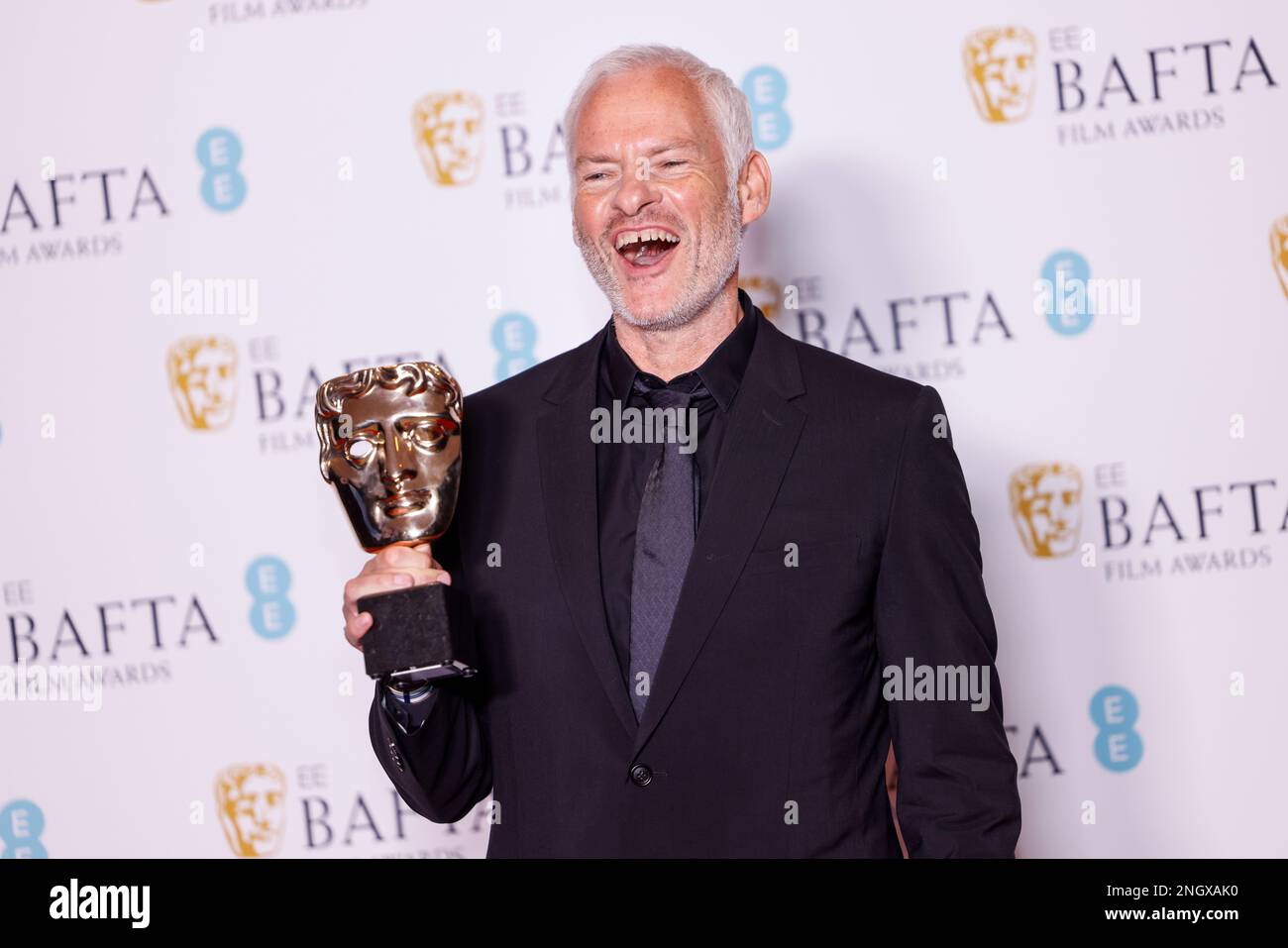 Martin McDonagh poses for photographers with the Original Screenplay award for the film 'The ...