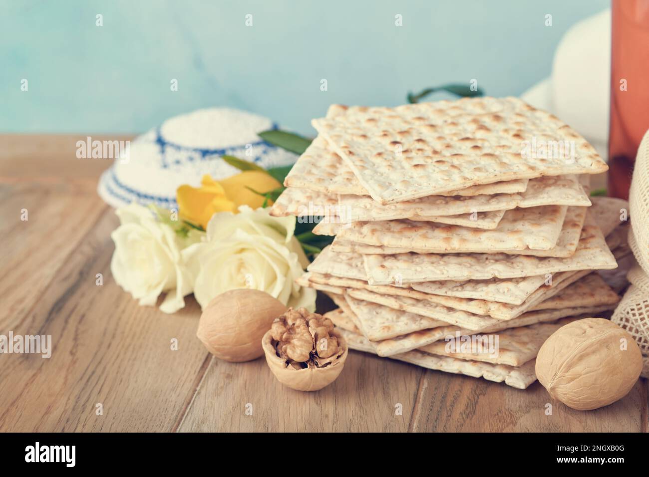 Passover celebration concept. Matzah, red kosher and walnut ...