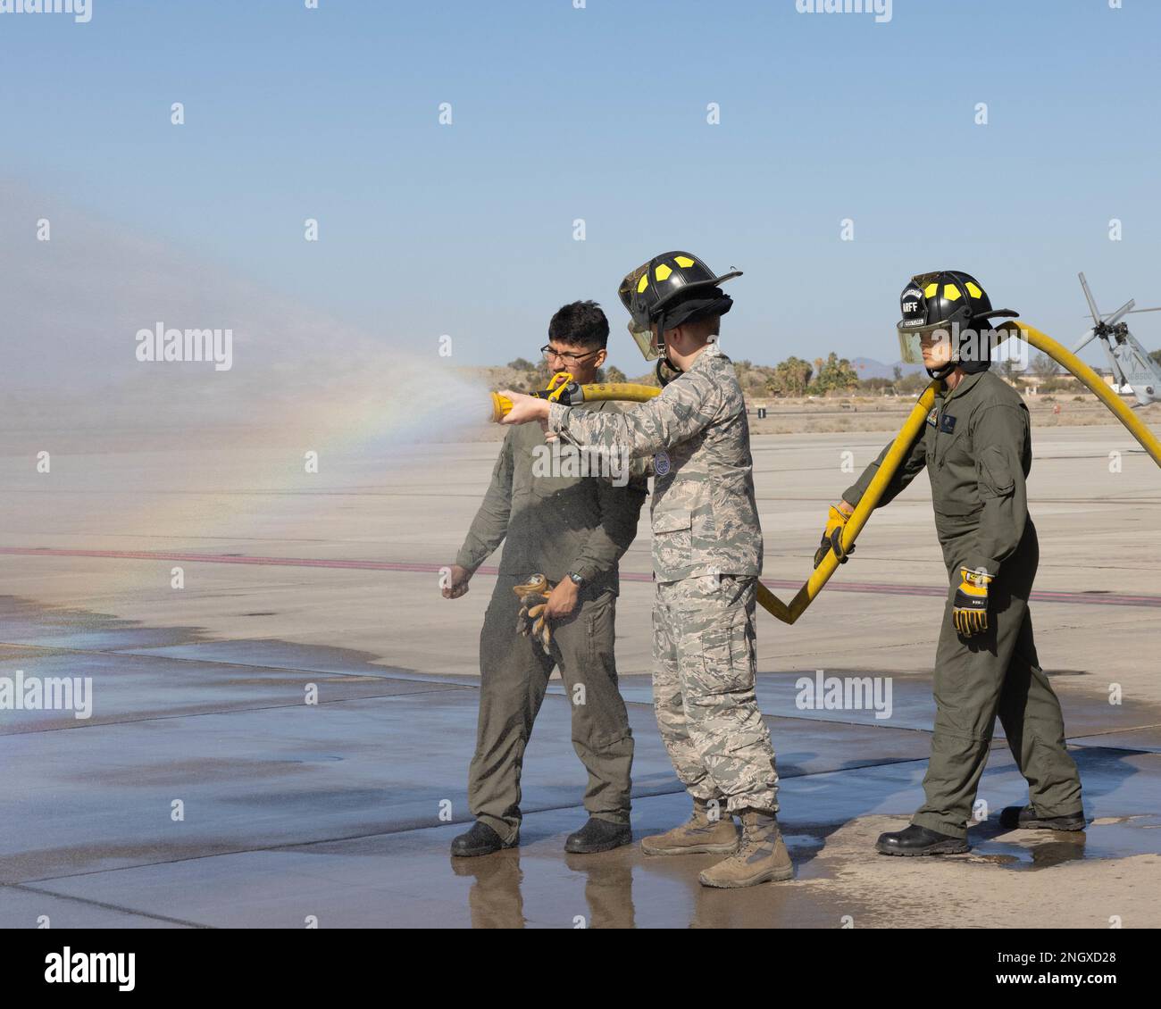 U.S. Marine Corps Lance Cpl. Abrhan Vasquez, left, firefighter ...